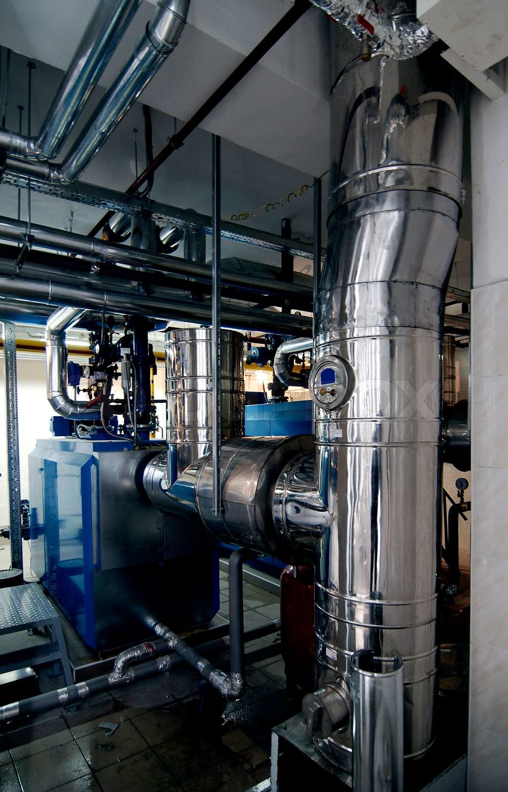 Interior of modern gas boiler room with manometers, valves, pumps and ...