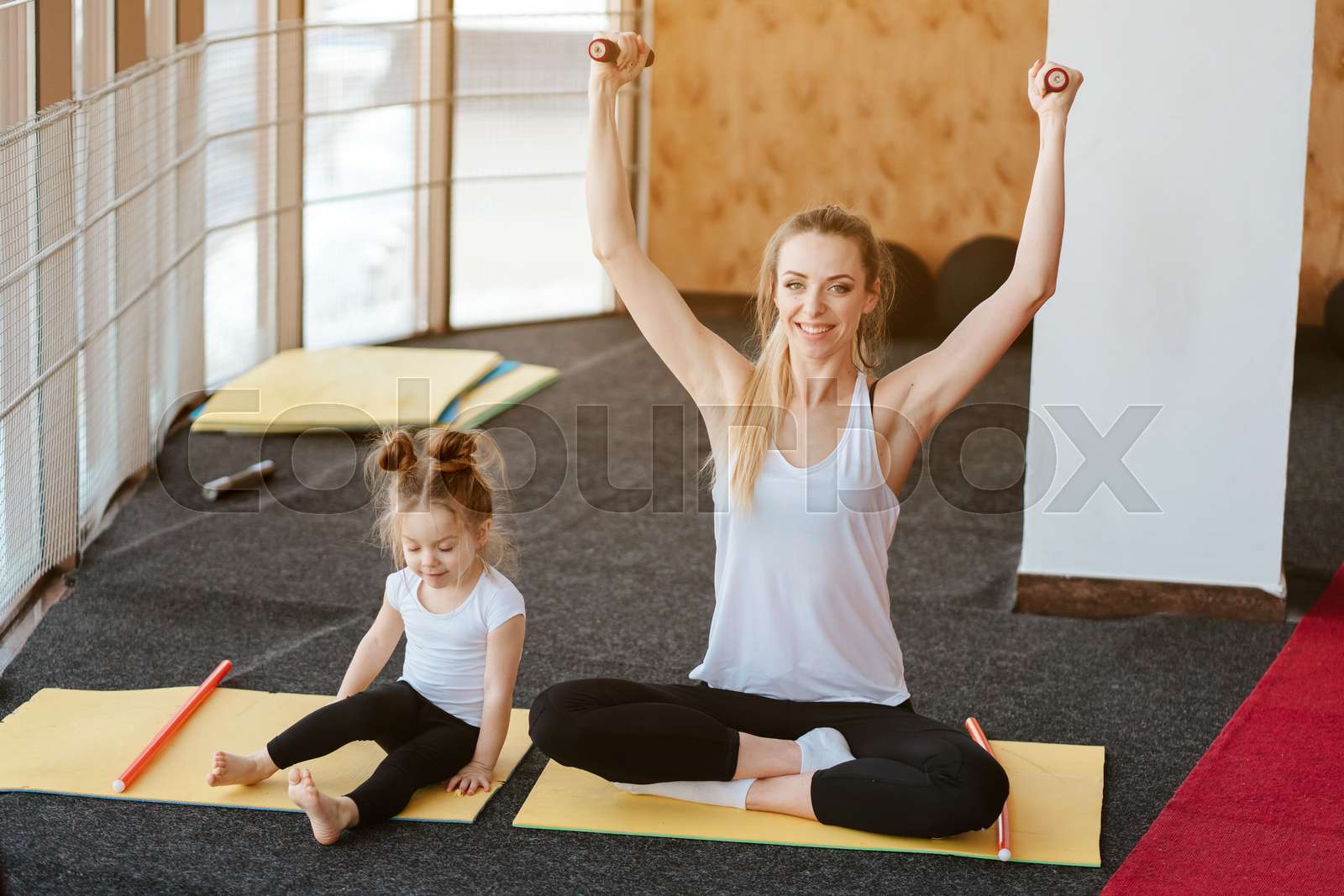 Mom and daughter together perform different exercises | Stock image ...