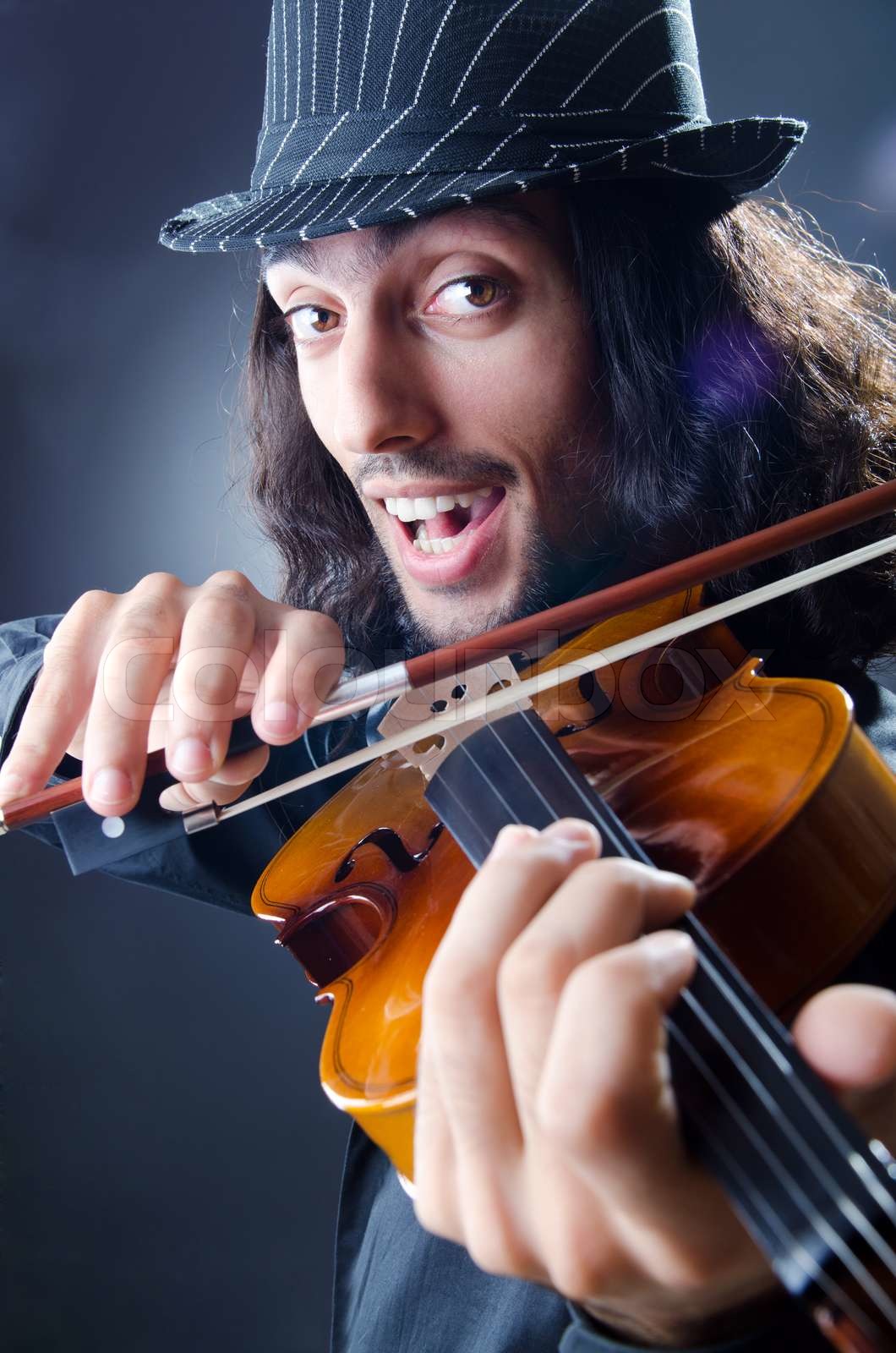 Gypsy violin player in studio | Stock image | Colourbox