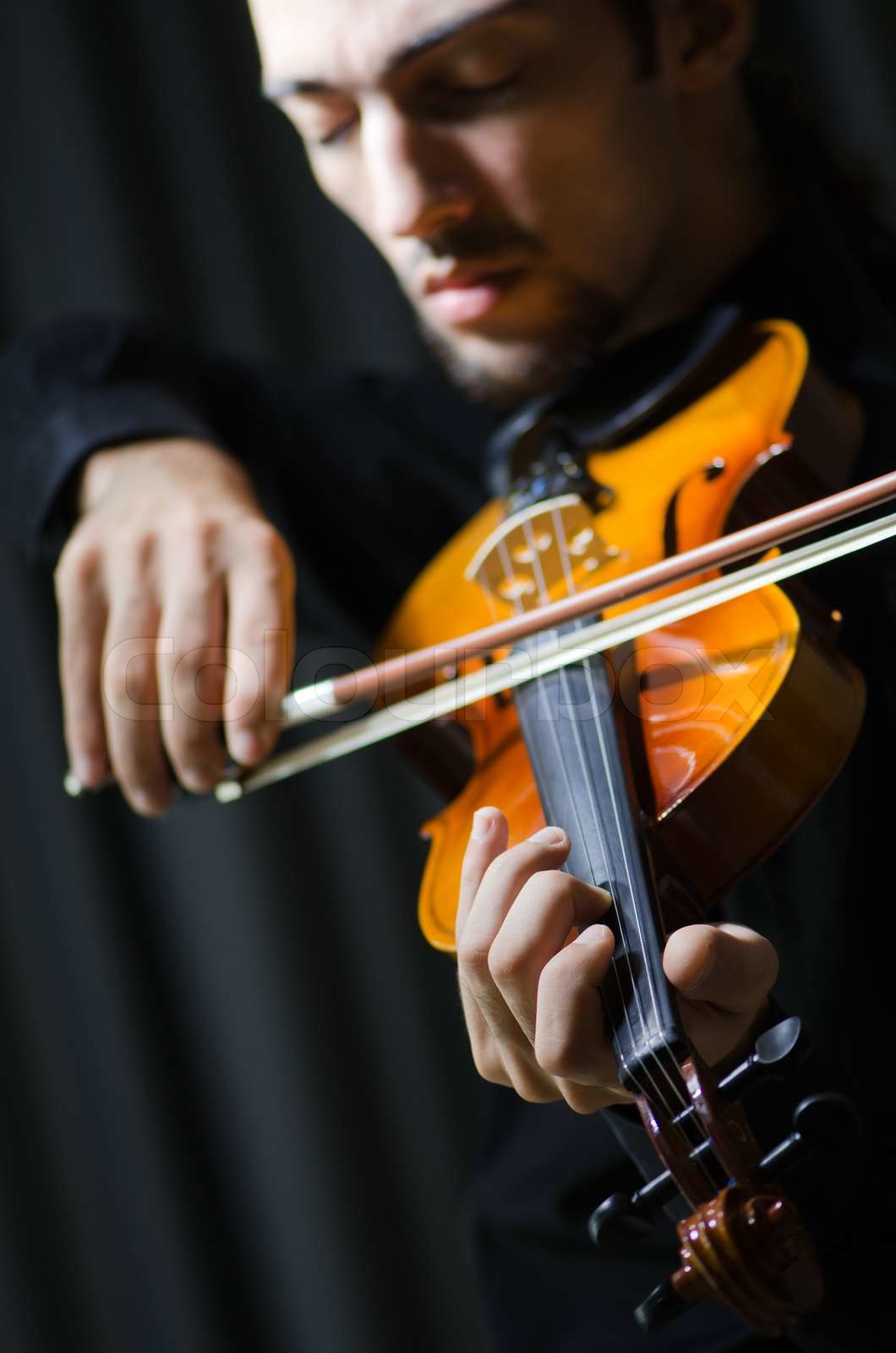Fiddler playing the violin | Stock image | Colourbox