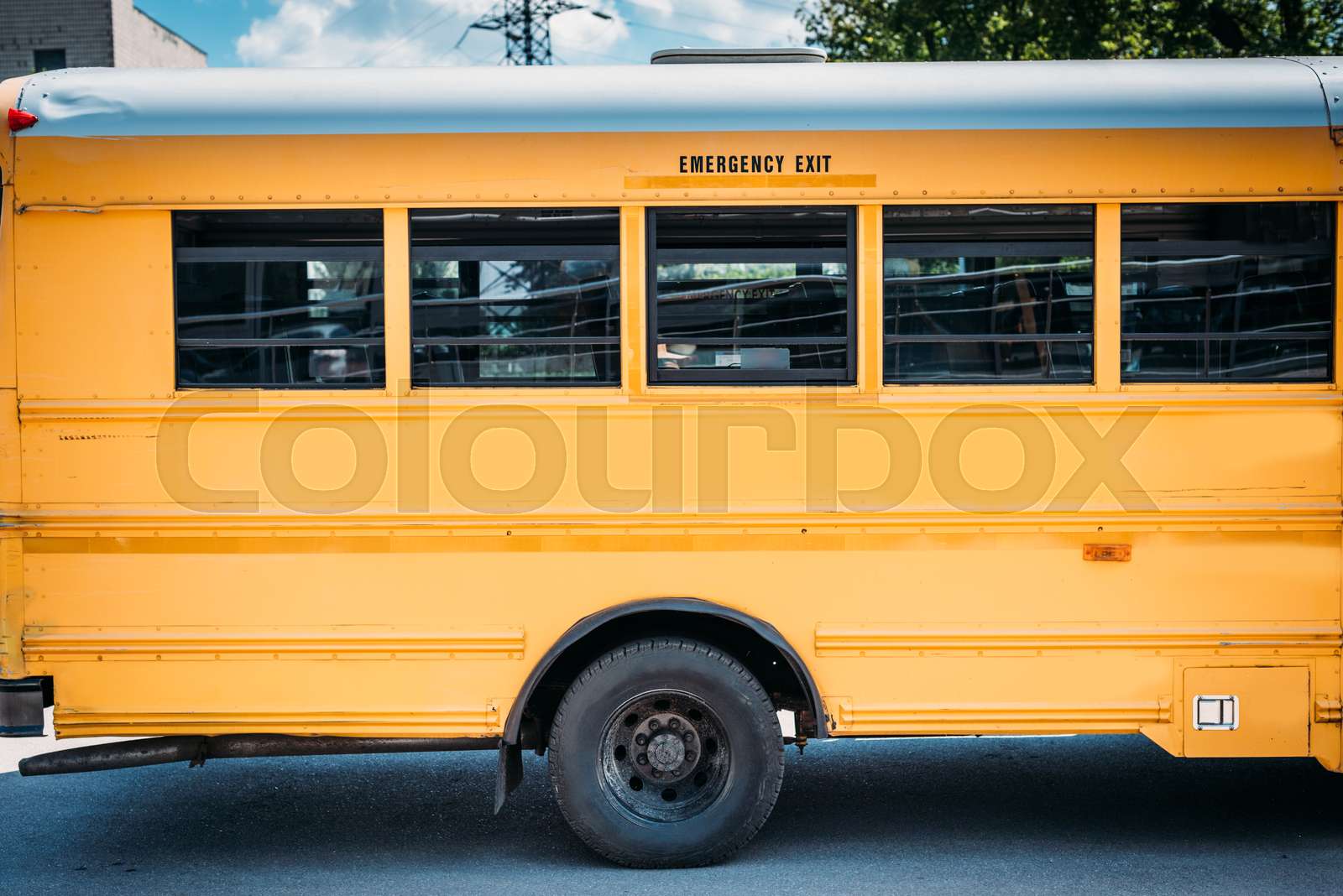 side view of parked empty school bus | Stock image | Colourbox
