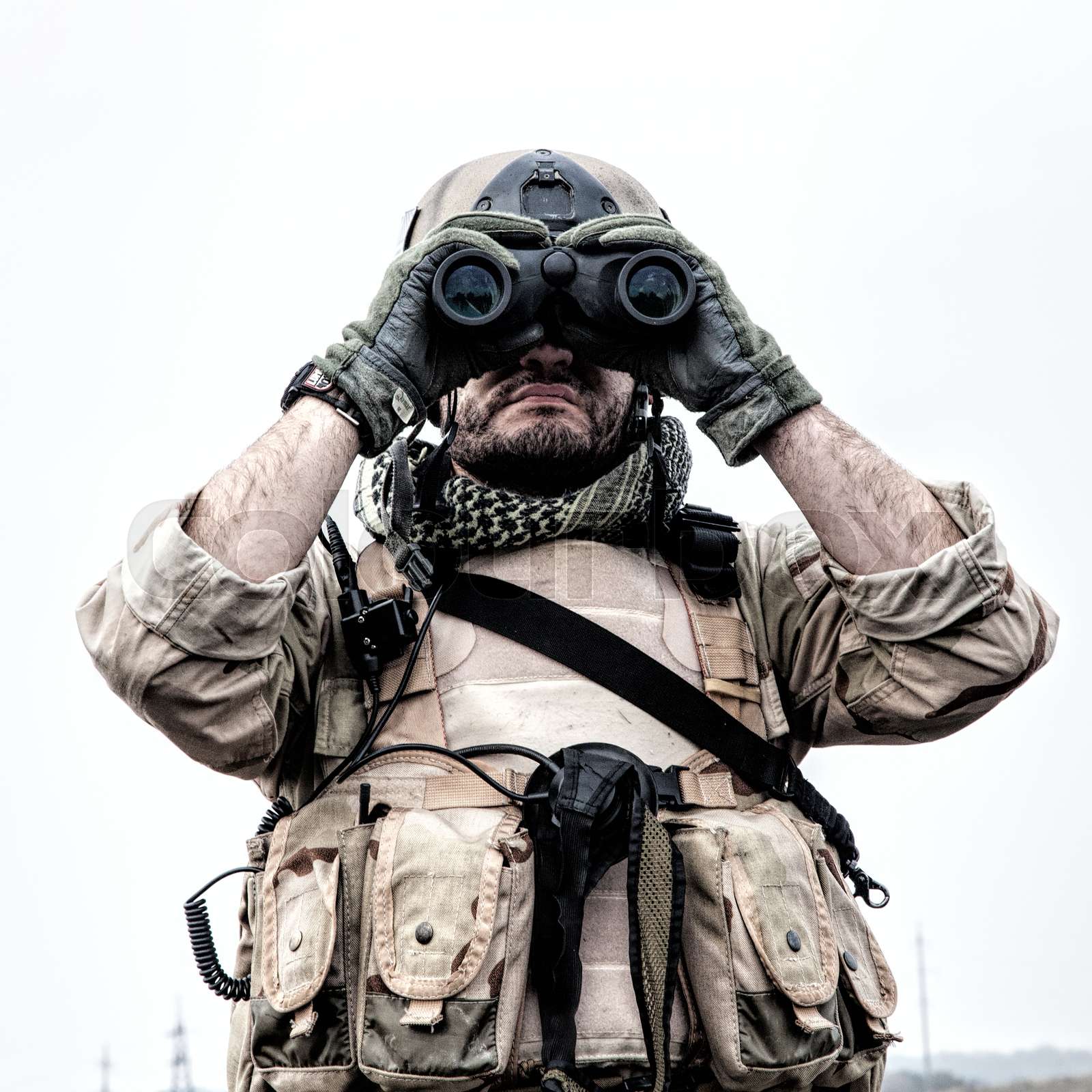 Commando soldier using binoculars to observe terrain | Stock image ...