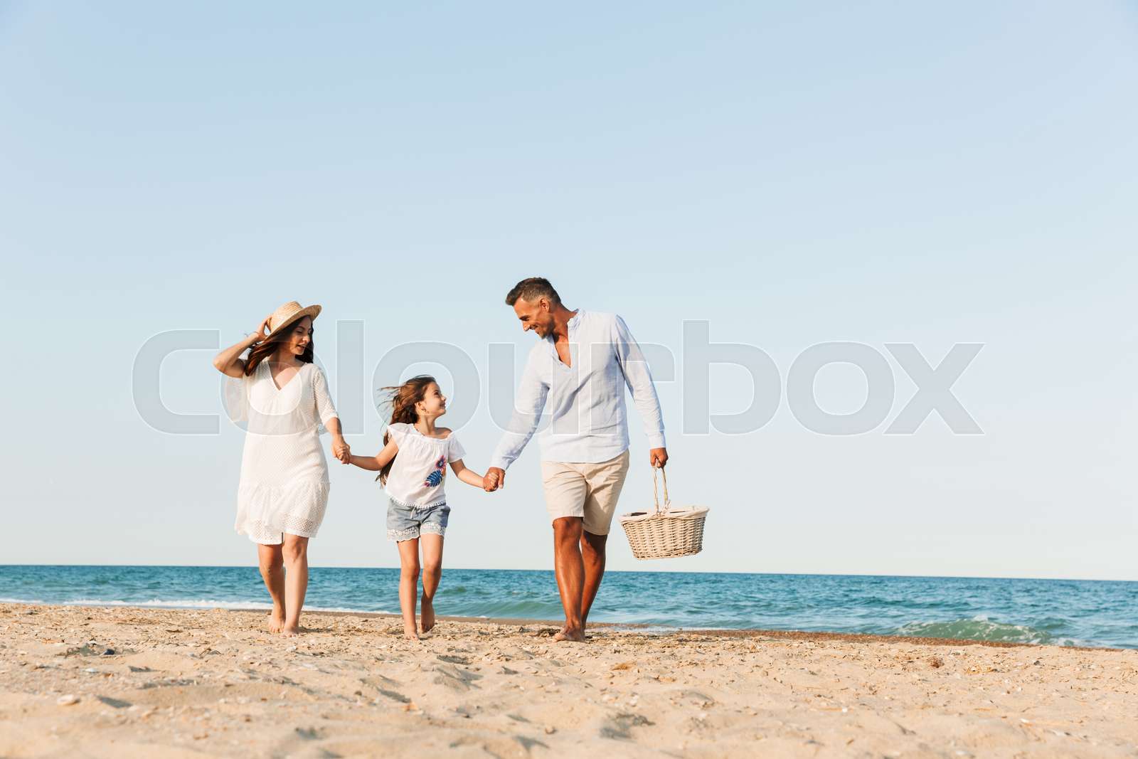 Happy family having fun together at the beach. | Stock image | Colourbox