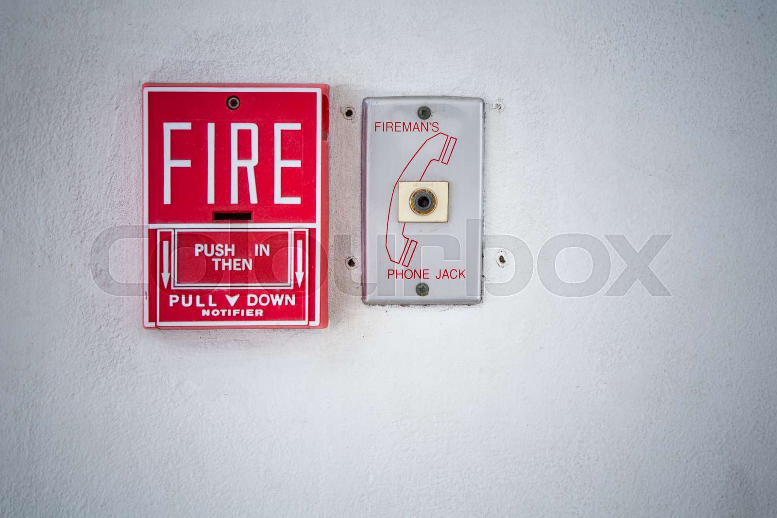 Red fire alarm switch | Stock image | Colourbox
