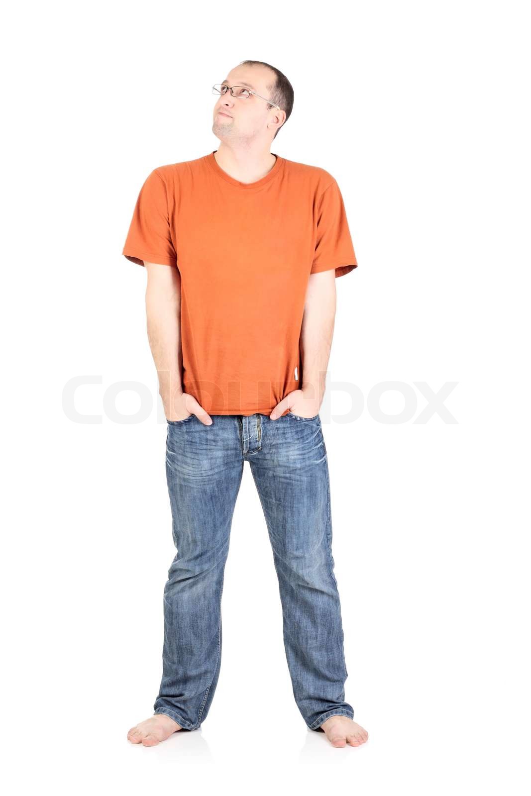 Eftertænksom ung mand kigger isoleret på den hvide | Stock foto | Colourbox