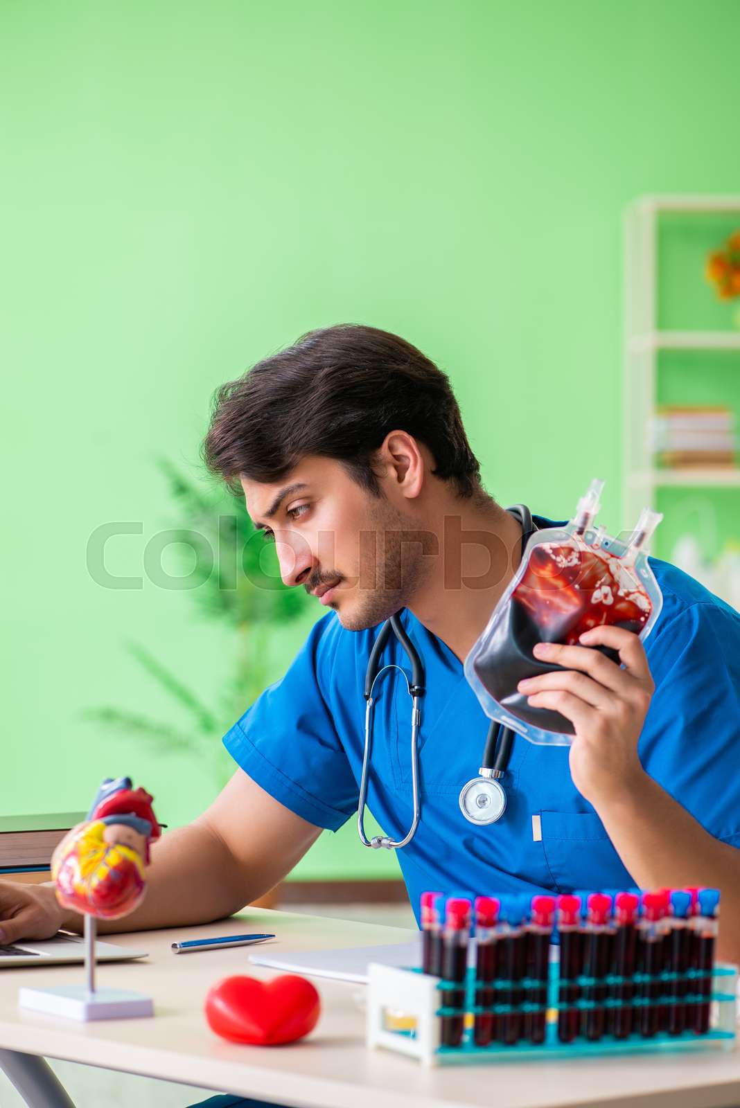 Doctor doing blood analysis in the lab | Stock image | Colourbox
