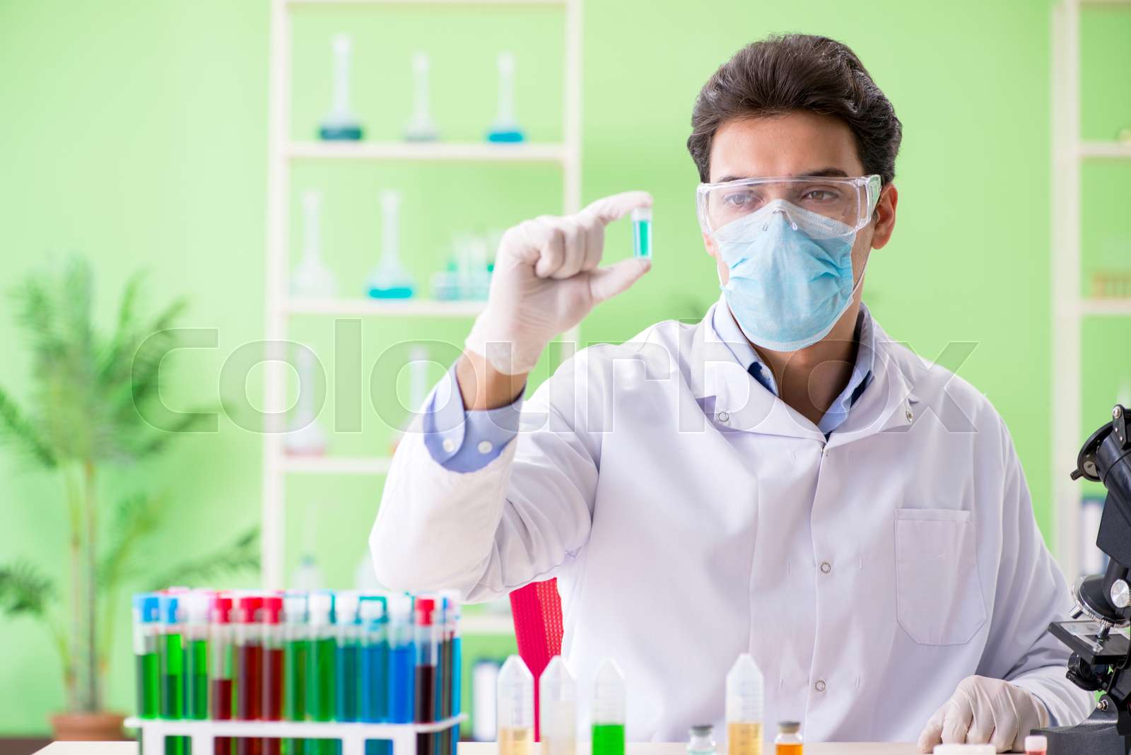 Man chemist working in the lab | Stock image | Colourbox