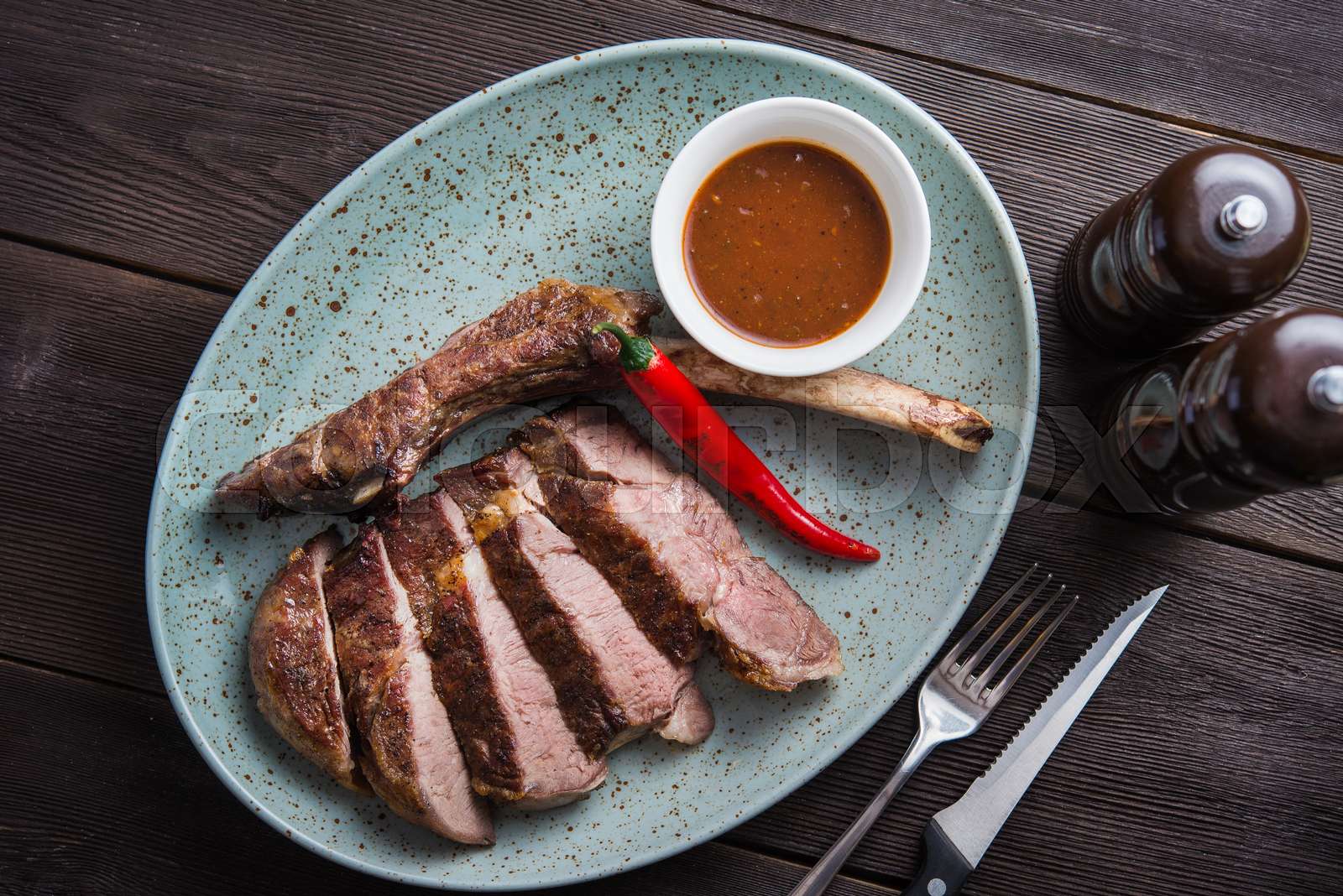 tomahawk rib steak with bbq sauce | Stock image | Colourbox