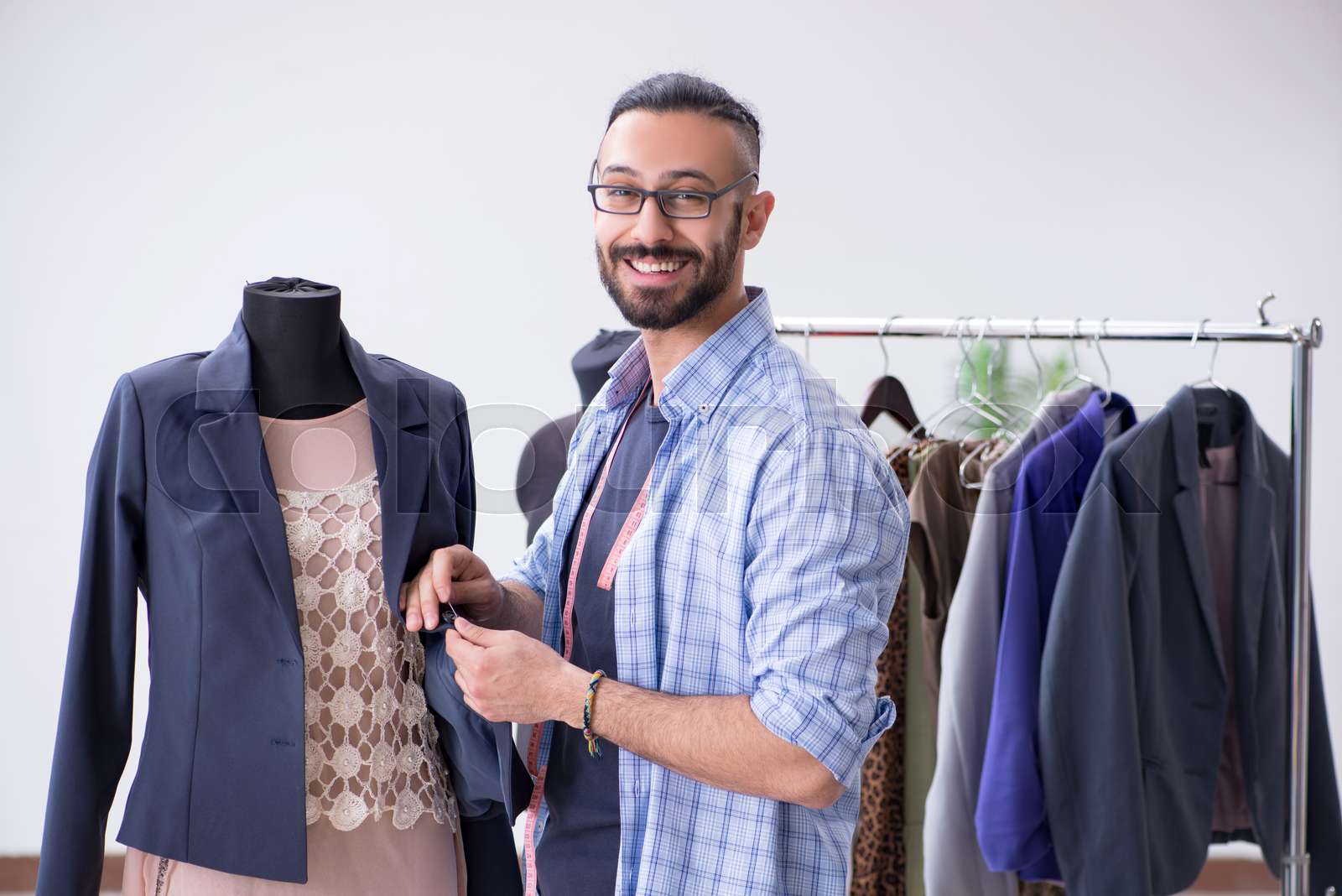 Male tailor working in the workshop on new designs | Stock image ...