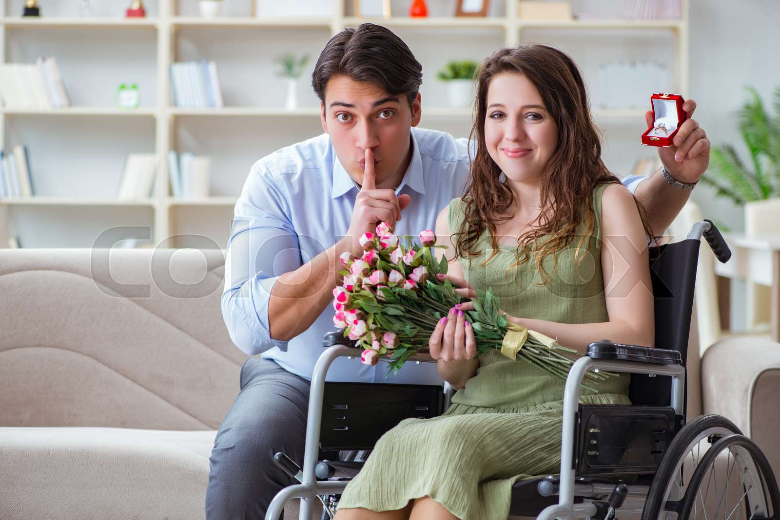 Man making marriage proposal to disabled woman on wheelchair | Stock ...