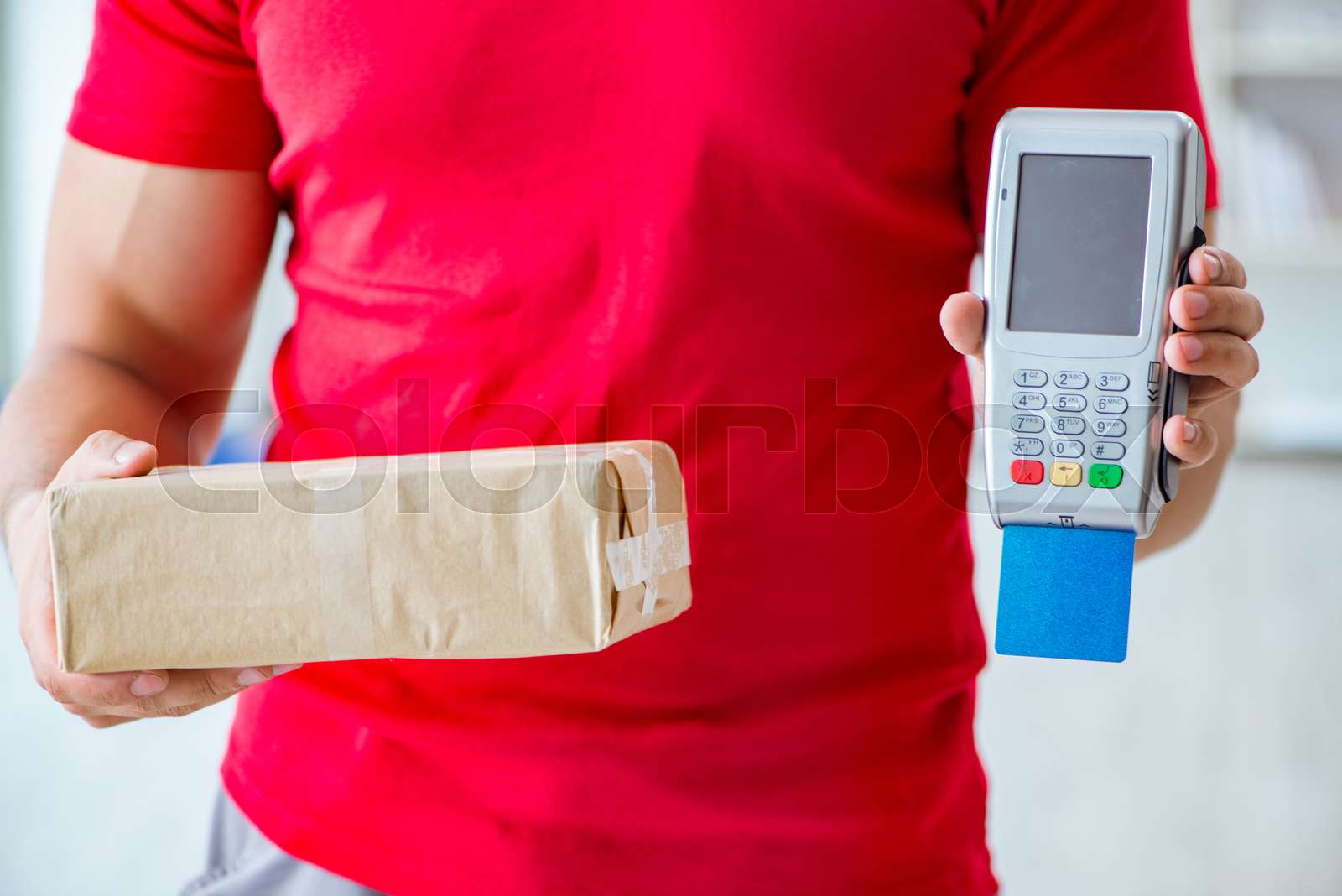Parcel delivery being paid with pos and credit card | Stock image ...