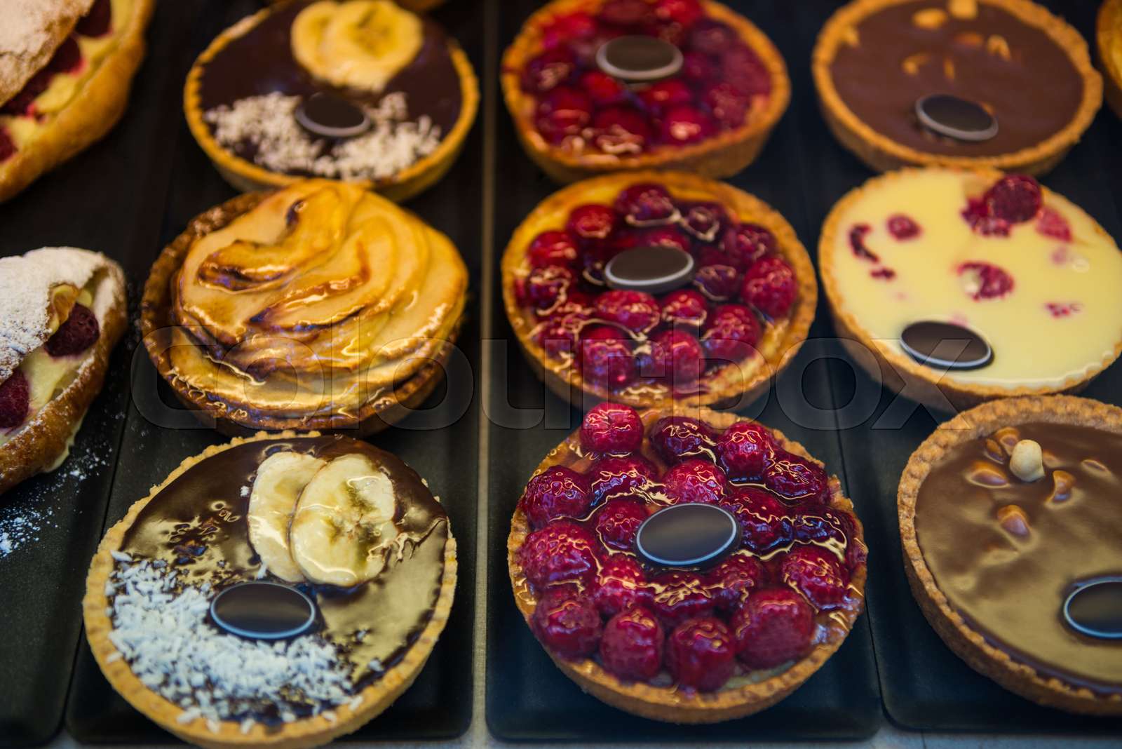 close up view of different tarts placed in rows | Stock image | Colourbox