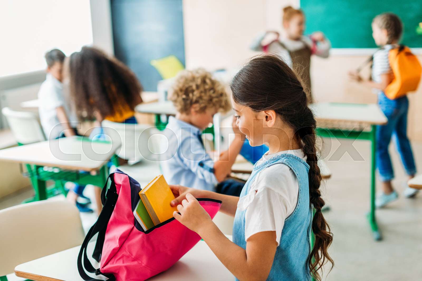 group of schoolchildren preparing for lesson at classroom | Stock image ...