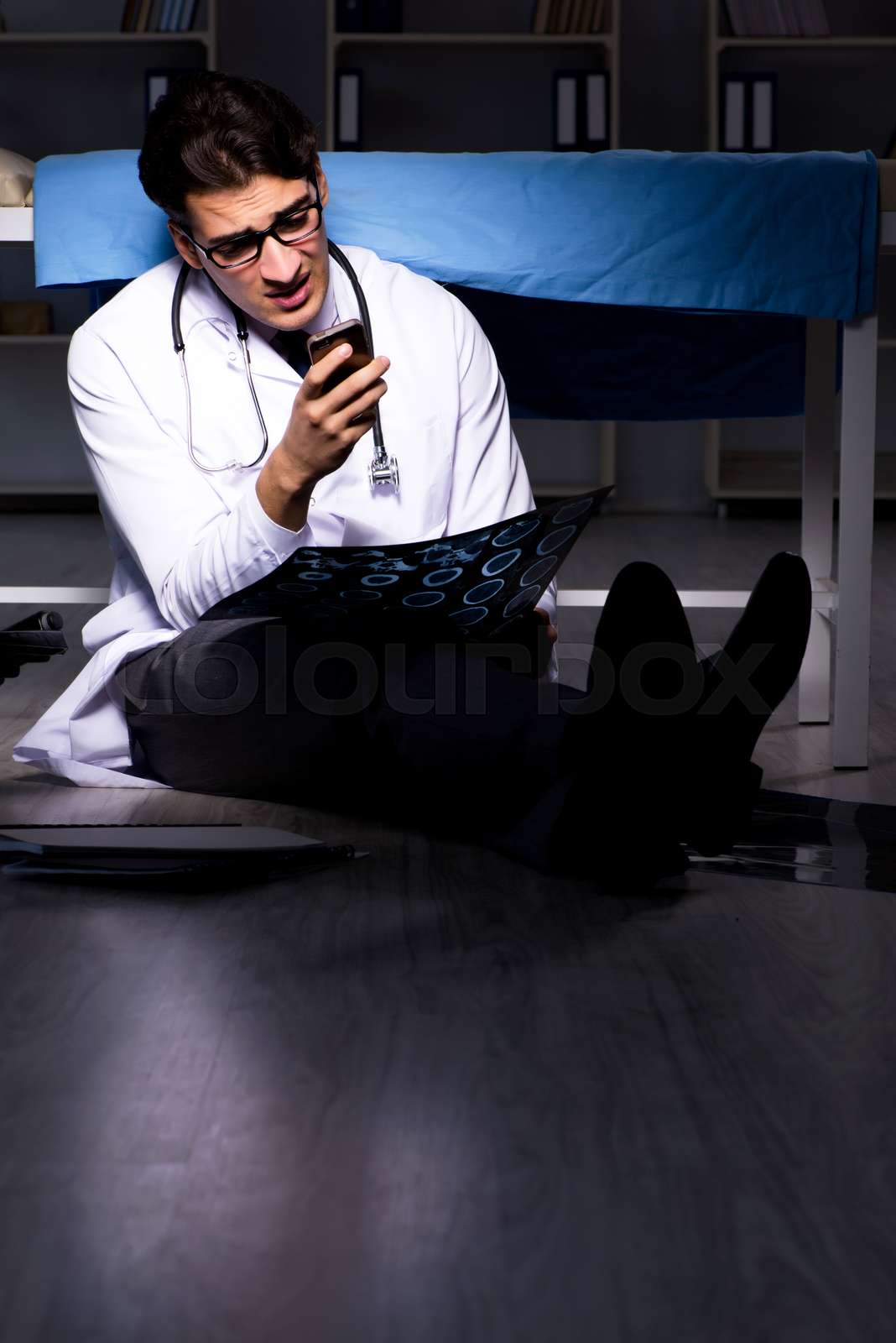 Doctor working night shift in hospital after long hours | Stock image ...