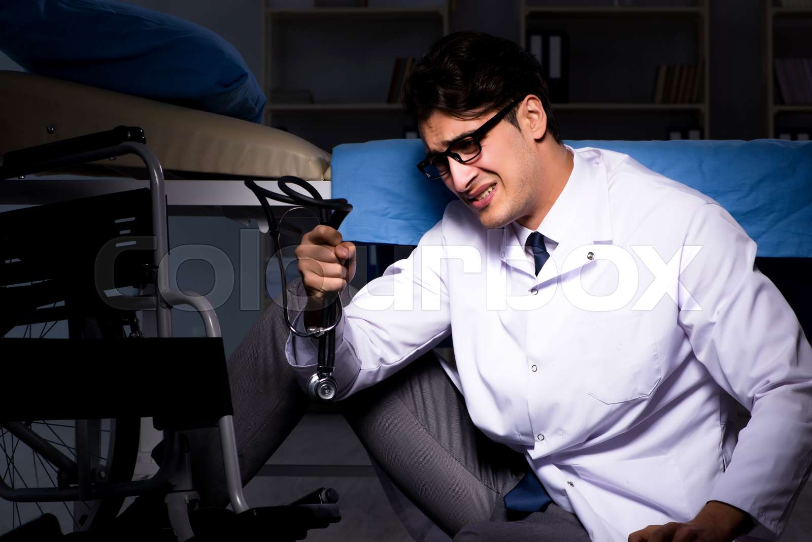 Doctor working night shift in hospital after long hours | Stock image ...