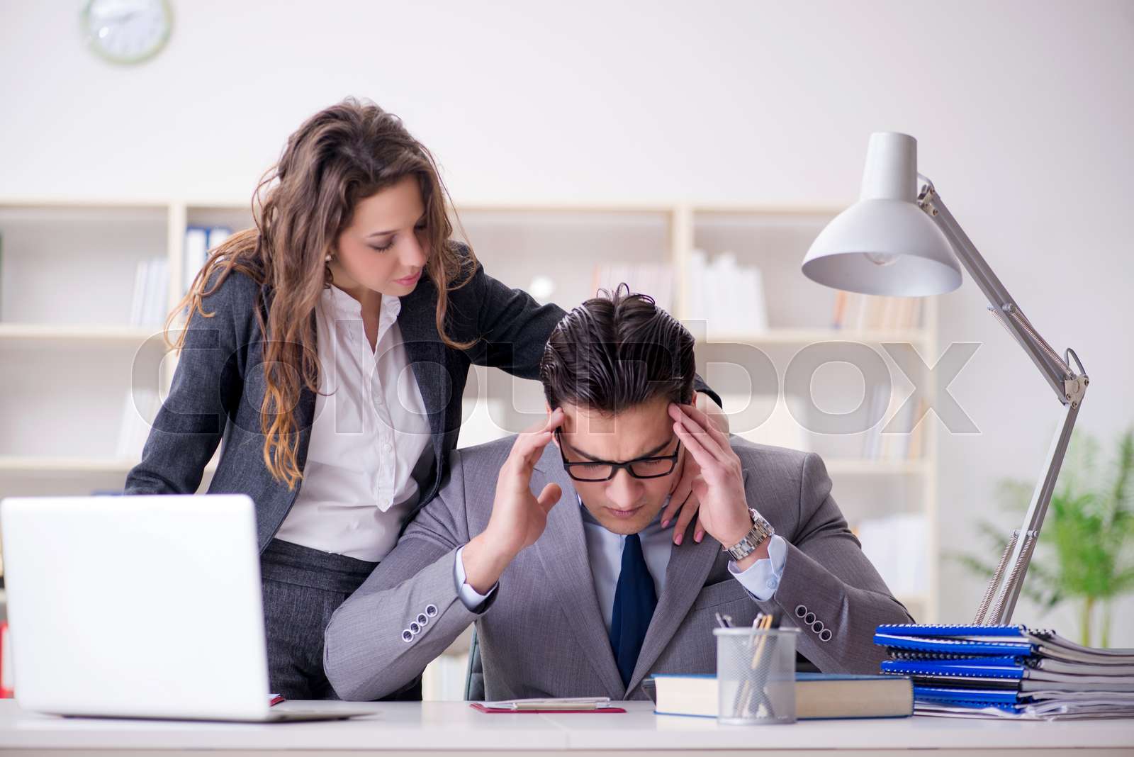Unhappy boss having a chat with his secretary | Stock image | Colourbox