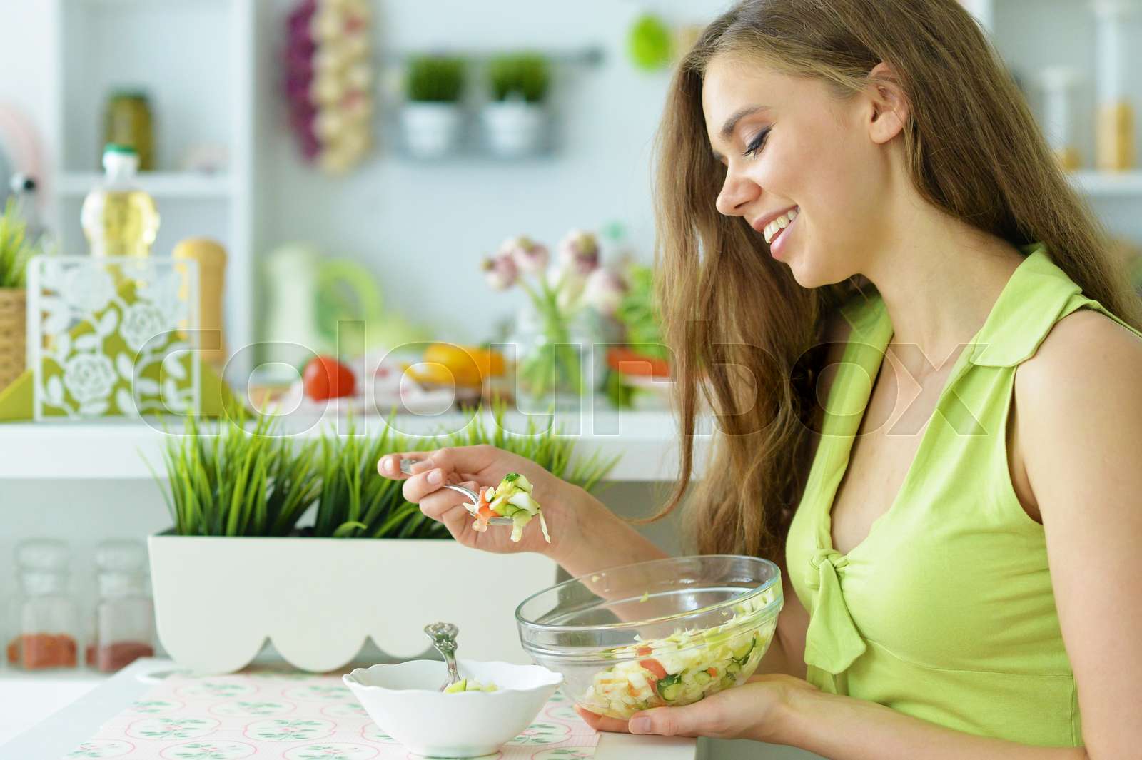 Portrait of young girl in the kitchen | Stock image | Colourbox