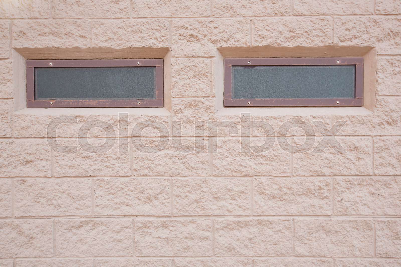 small brown glass window on squre wall tile | Stock image | Colourbox