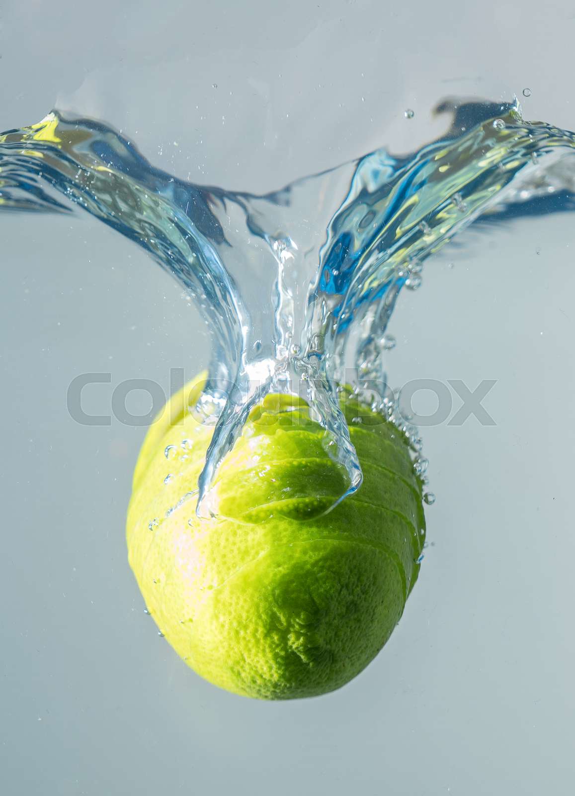 Fresh lime falling into the water. Suitable for advertisement. | Stock ...