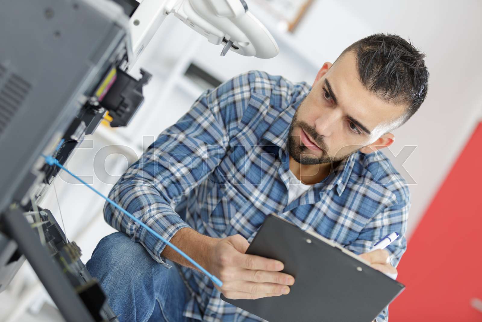 man technician repairing a printer at business place at work | Stock ...