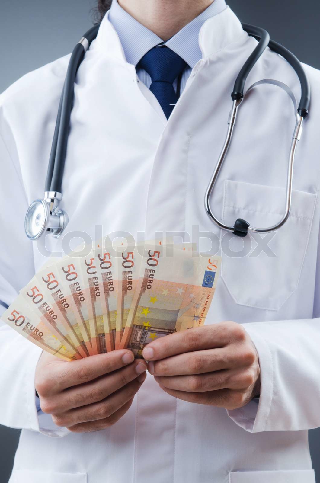 Doctor with euro money | Stock image | Colourbox