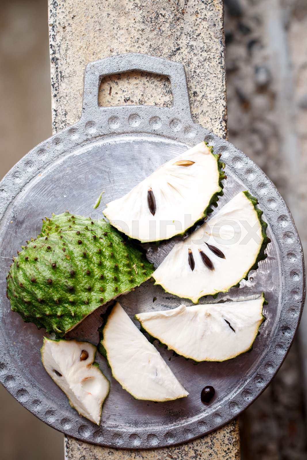 guanabana cut on a plate | Stock image | Colourbox