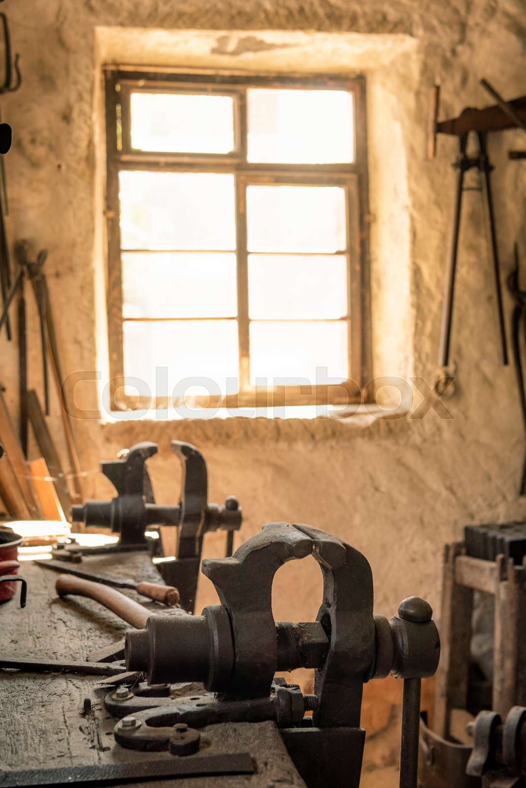 Blacksmith workbench with a vise grip | Stock image | Colourbox
