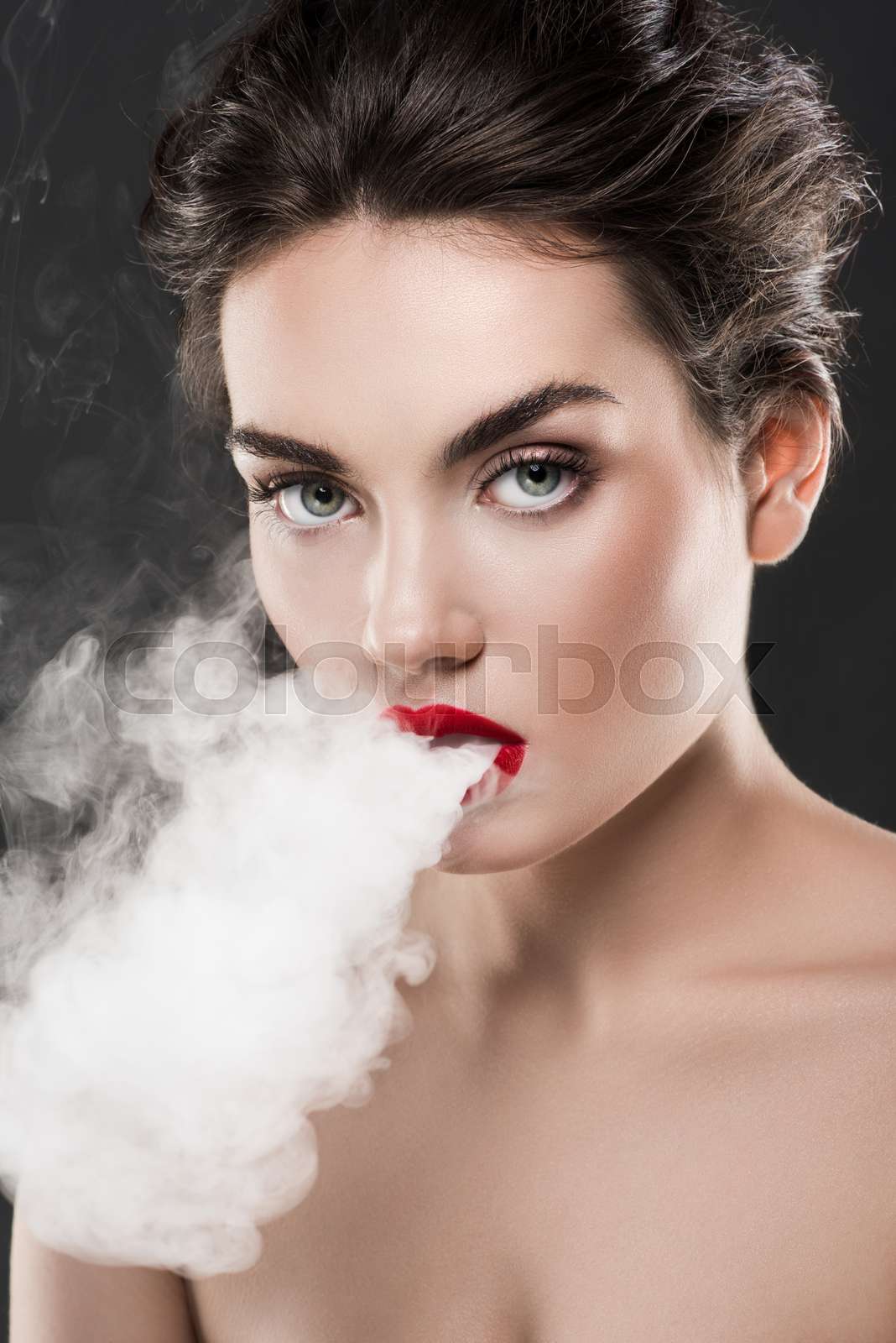 Girl Blowing Smoke