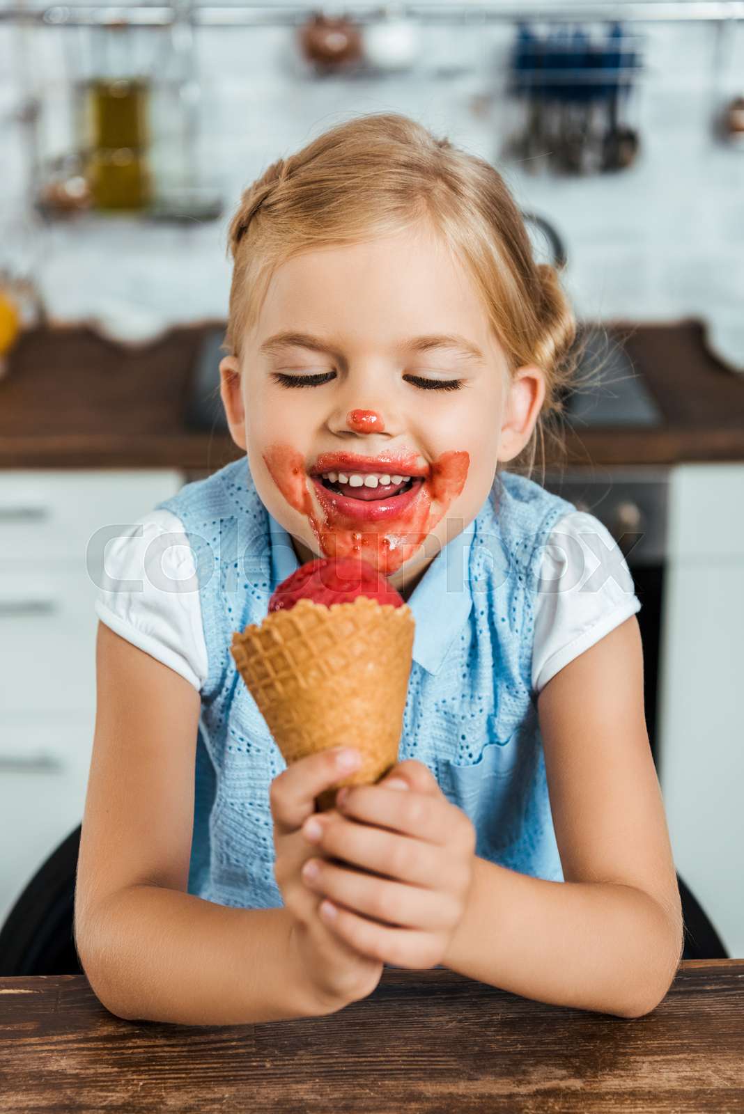 adorable happy kid eating delicious sweet ice cream cone | Stock image ...