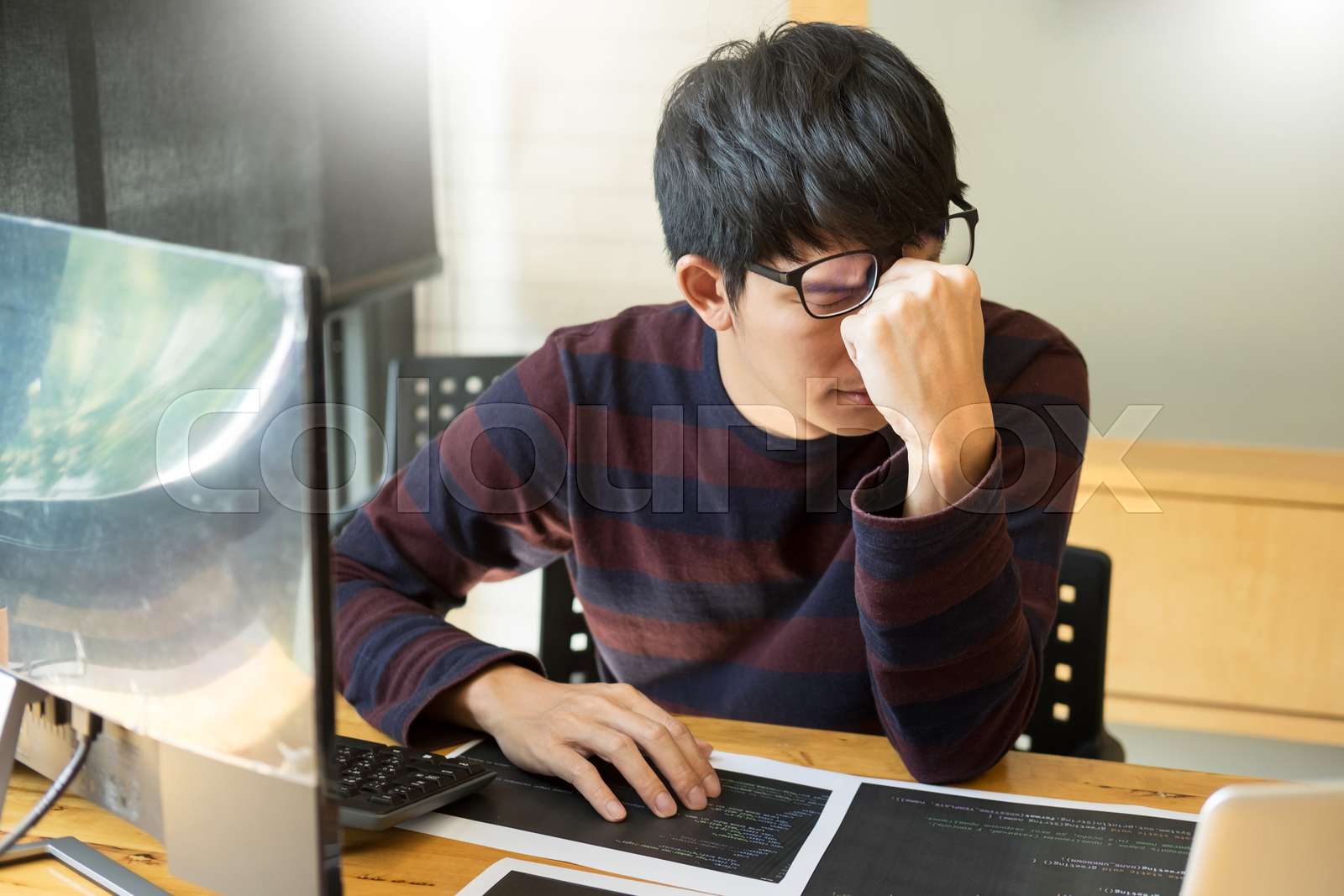 Young modern stressed programmer businessman a brake from working with ...