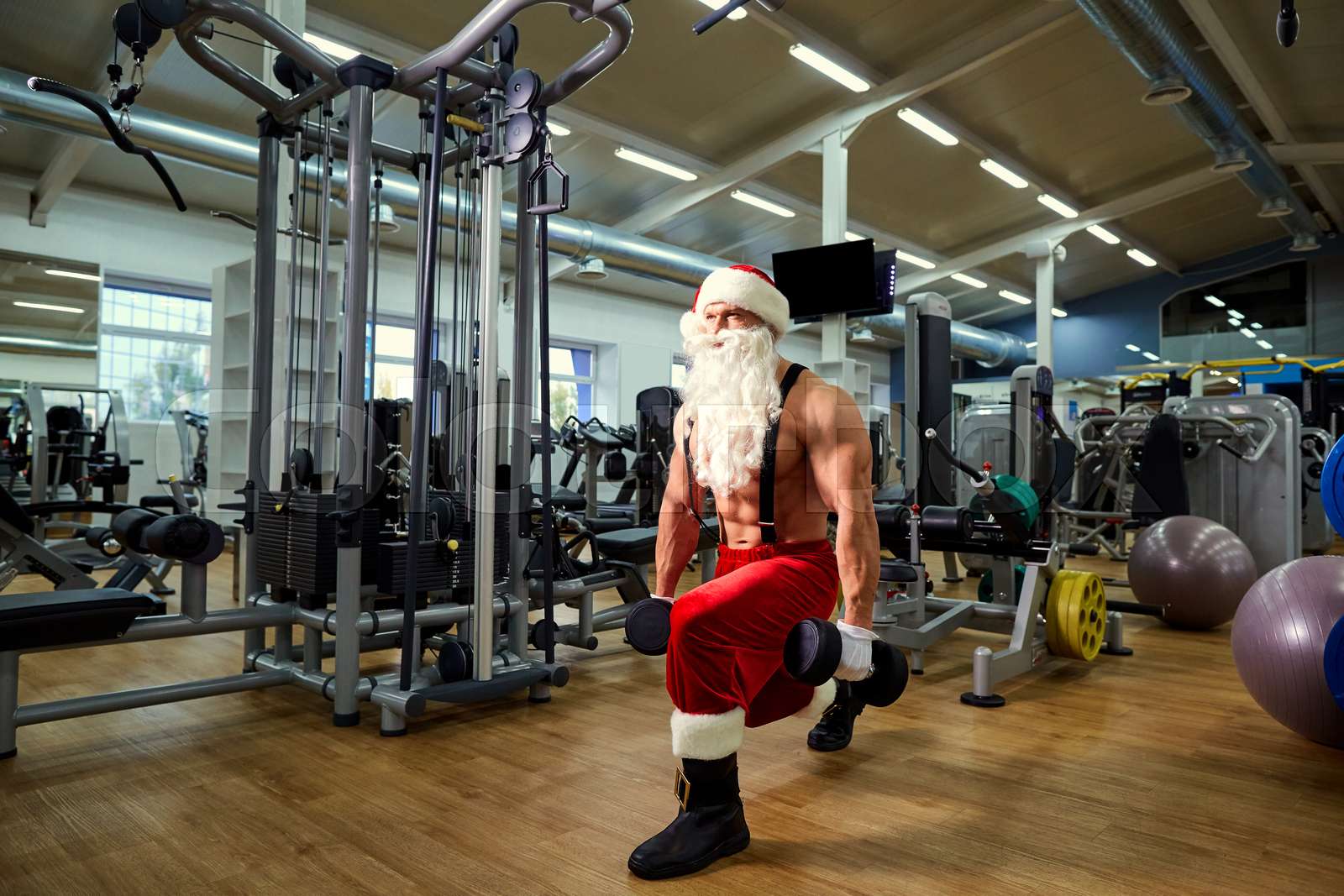 Santa Claus Bodybuilder training at the gym. | Stock image | Colourbox