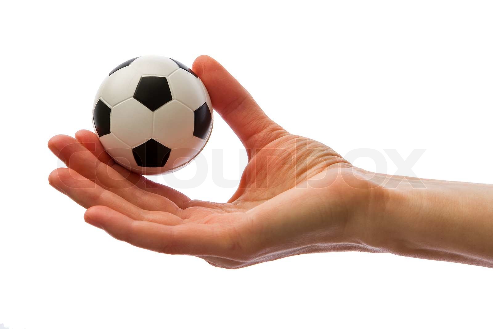 Little soccer ball in hand | Stock image | Colourbox