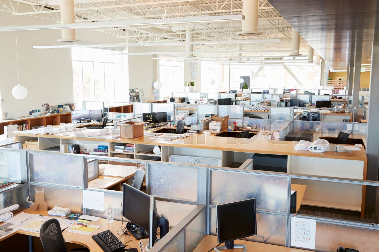 Elevated view of workstations and desks in open plan office | Stock ...