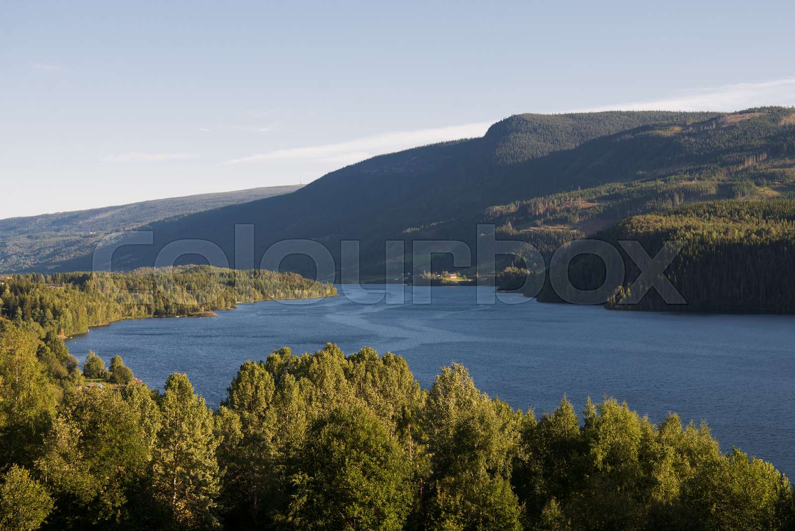 aerial view of lake, green trees and mountains, Hallingskarvet National ...
