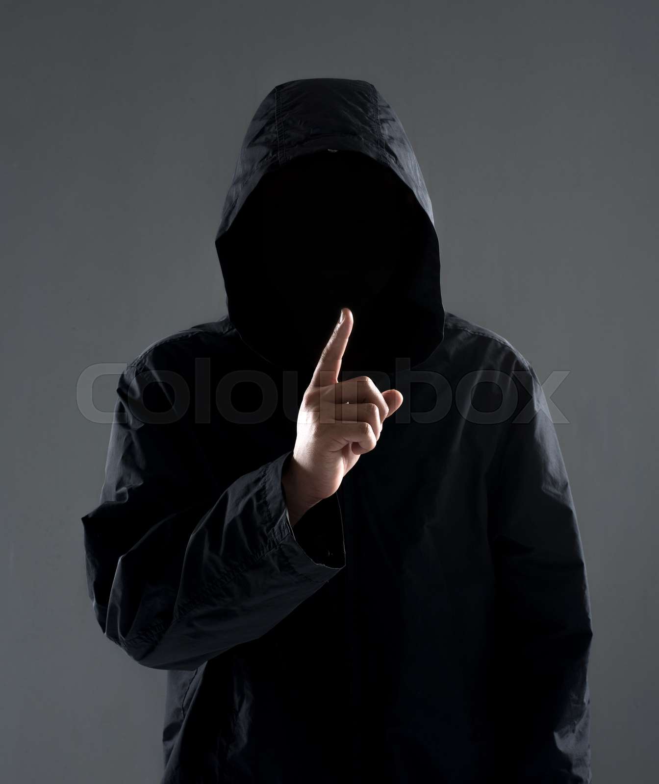 Mysterious man with hidden face in a hoodie | Stock image | Colourbox