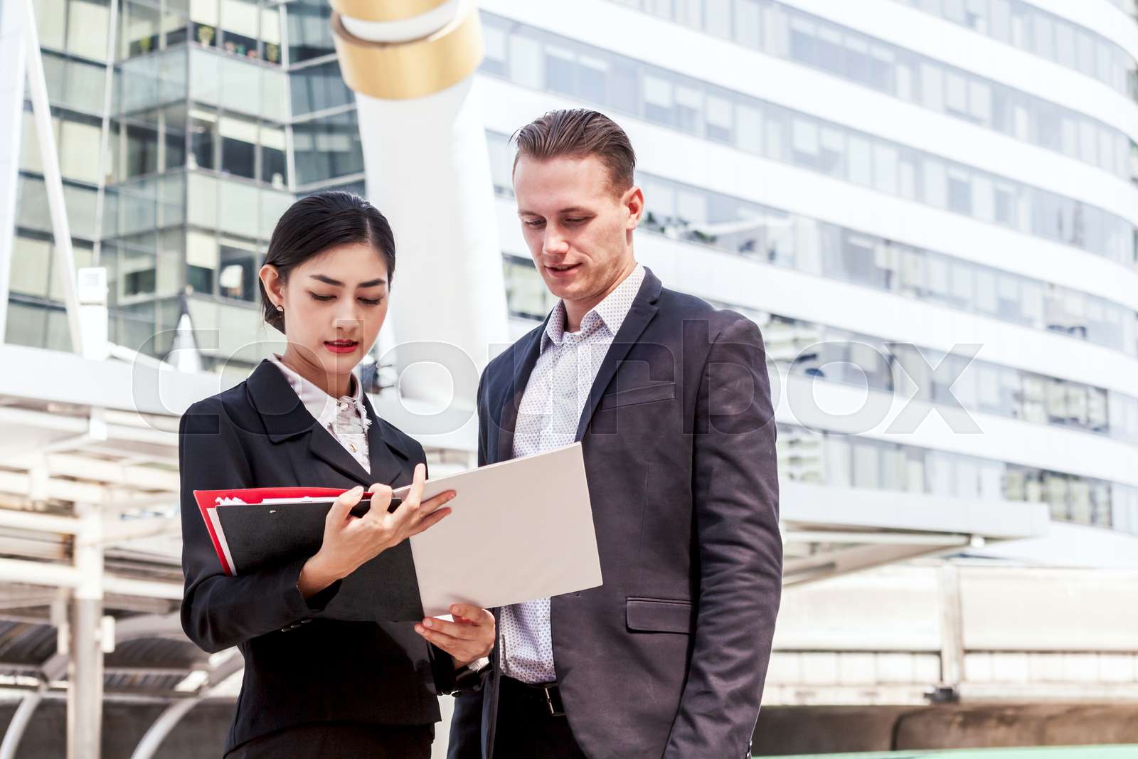 Image two business partners talking and working together | Stock image ...