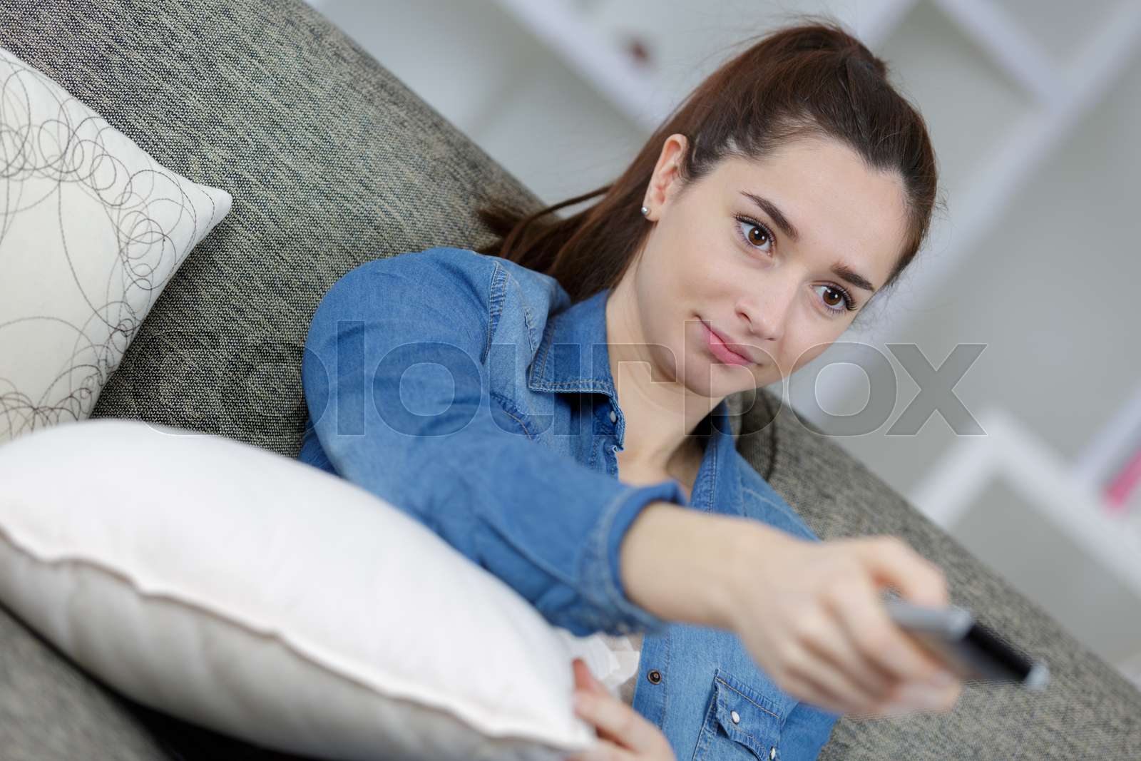 young girl with a remote control | Stock image | Colourbox