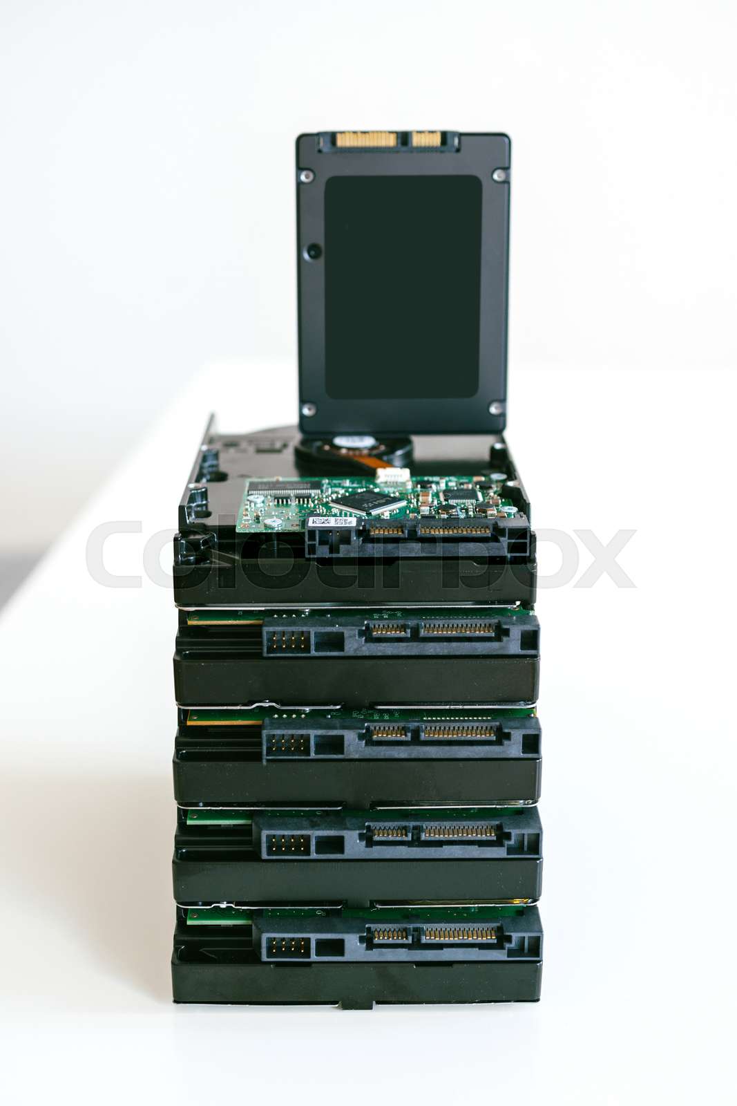 Stack of multiple HDD with vertically positioned SSD | Stock image ...