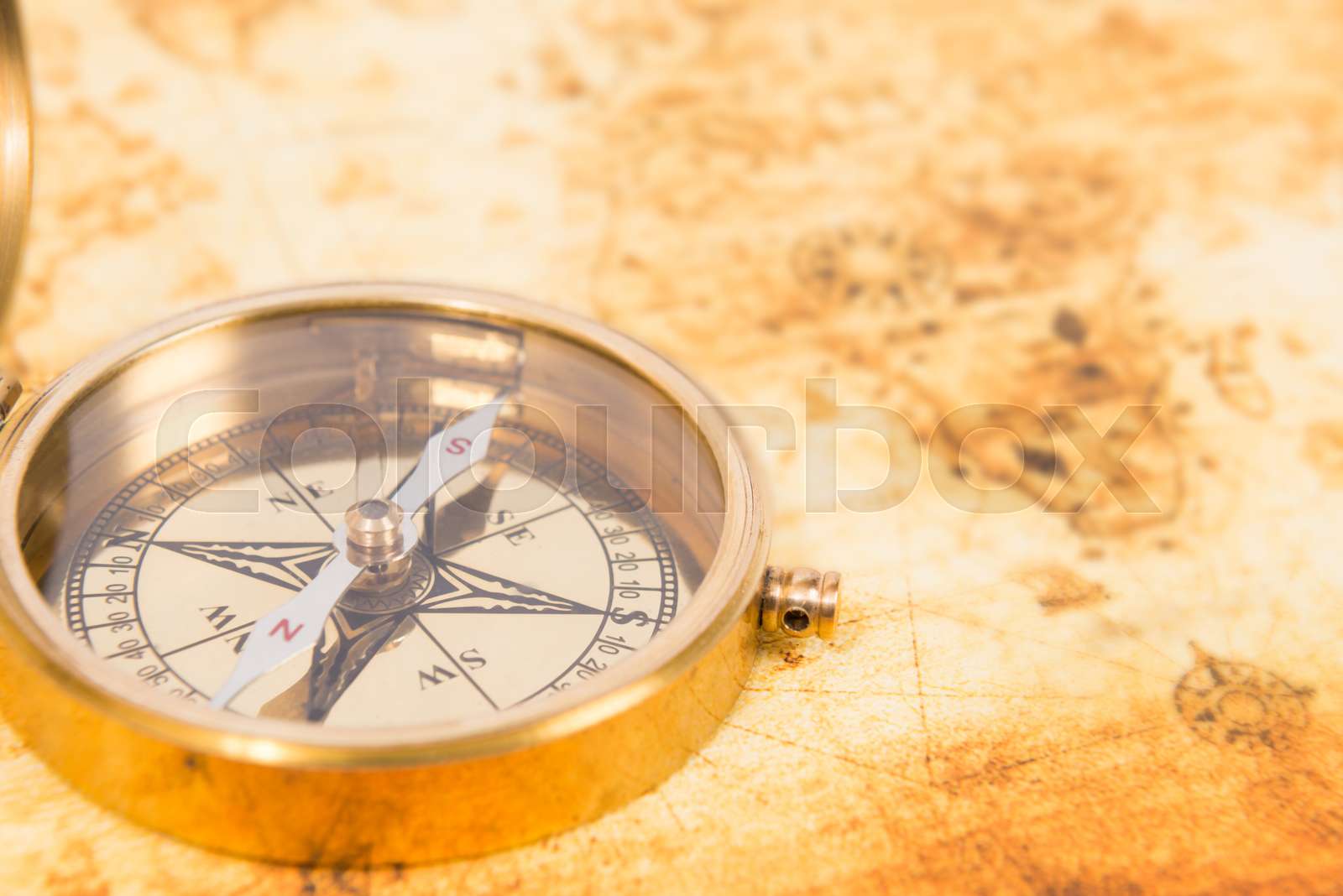 Old map with an ancient compass | Stock image | Colourbox