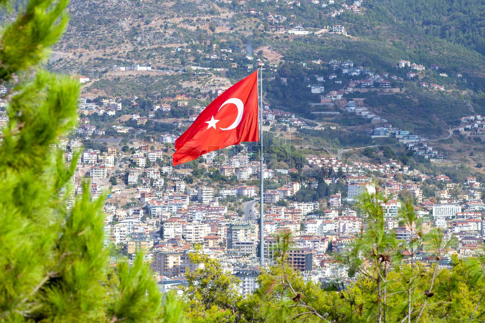 Turkish flag in front of the city of Antalya | Stock image | Colourbox