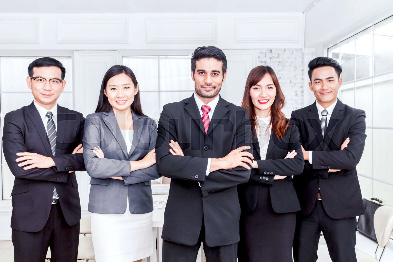 Professional business man and woman at office | Stock image | Colourbox