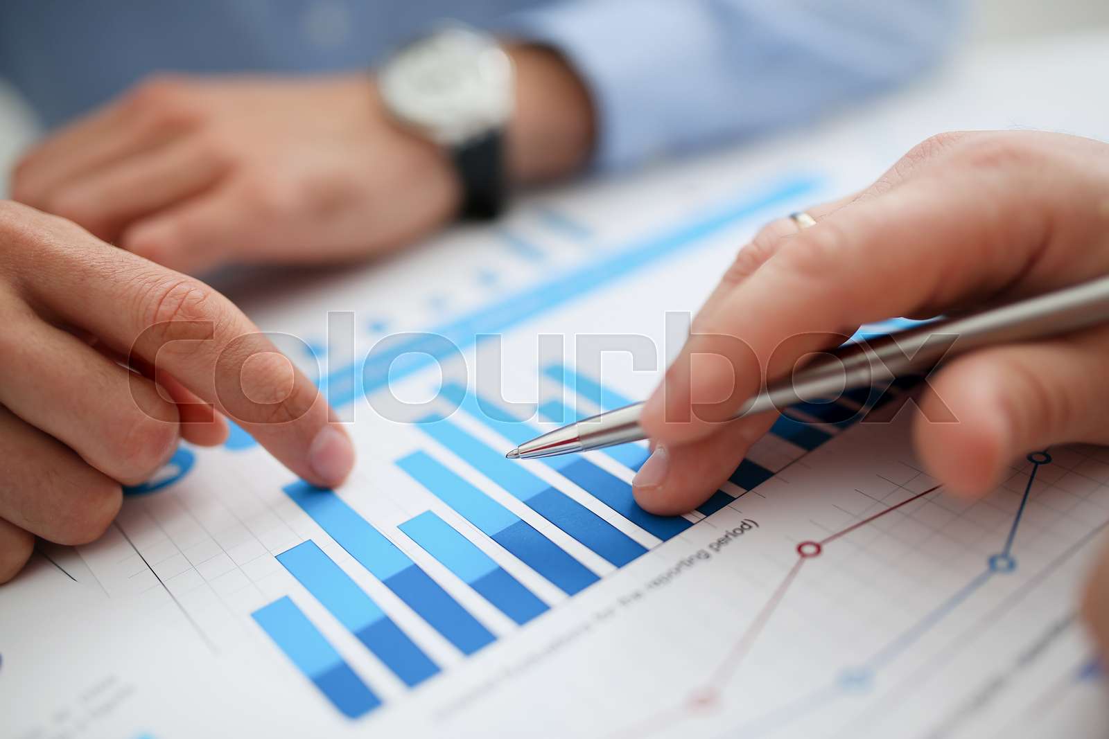 Group of people deliberate on problem with infographics | Stock image ...