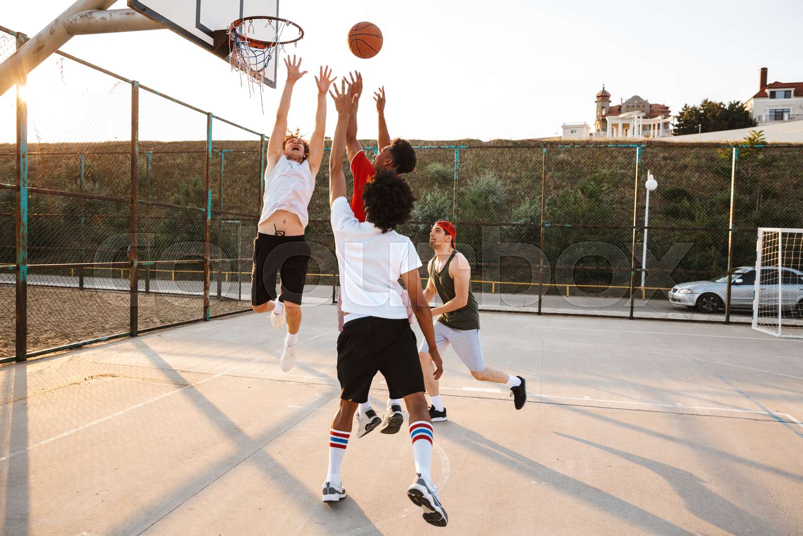 Group of young excited multiethnic men basketball players | Stock image ...