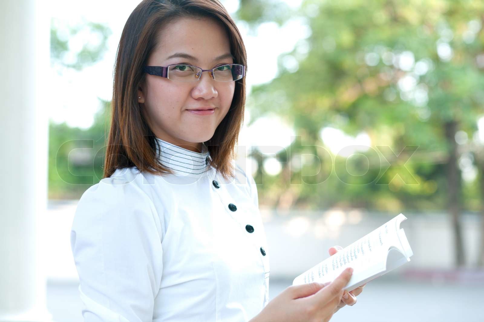 woman carry book | Stock image | Colourbox