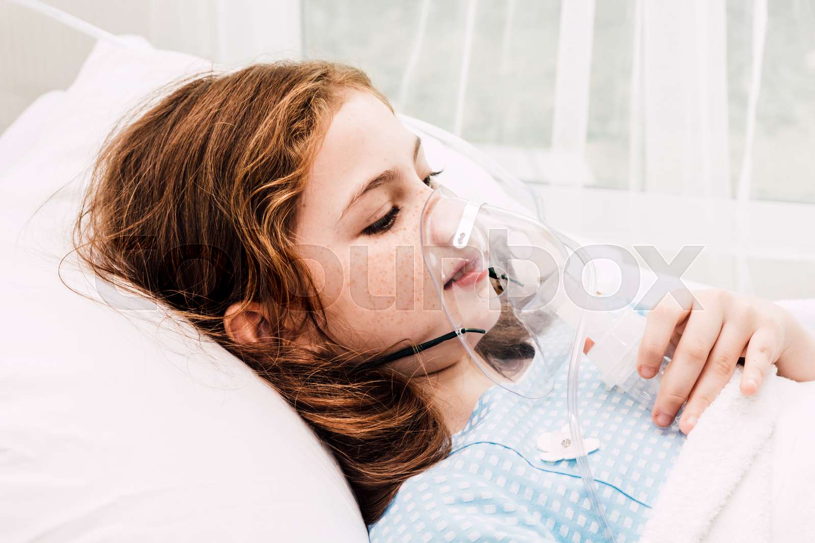 Cute little girl oxygen mask on her face on bed in the hospital | Stock ...