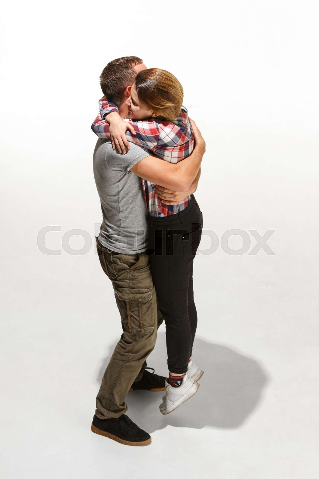 Full body portrait of hugging couple with smile. Caucasian models in ...