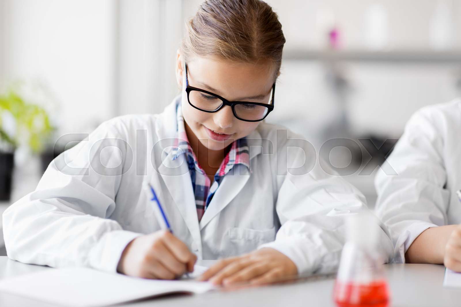 girl studying chemistry at school laboratory | Stock image | Colourbox
