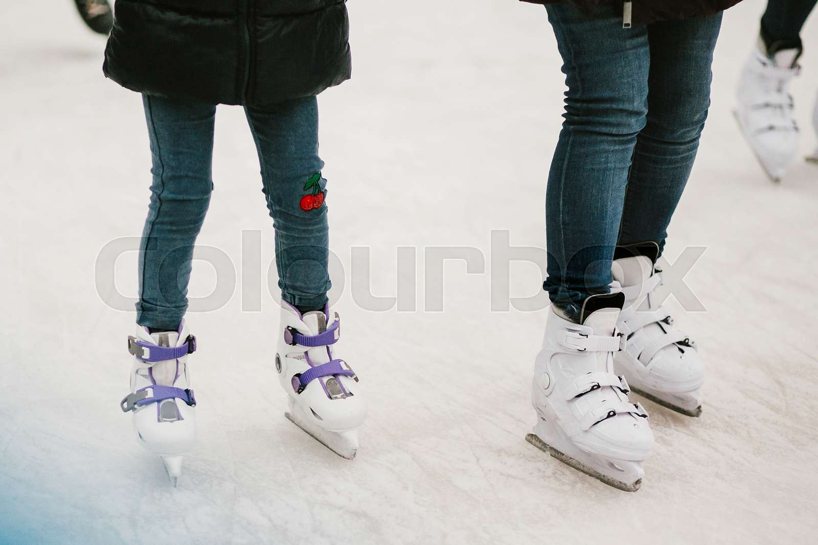 Skaters skating on iceskating ring in european city center in winter ...