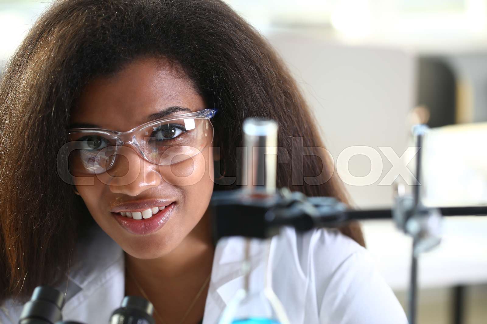 Black female chemist student conducting research | Stock image | Colourbox