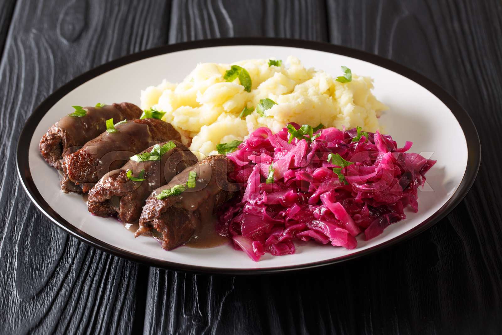 German Rouladen tender rolls of beef filled with pickles, onions, and ...